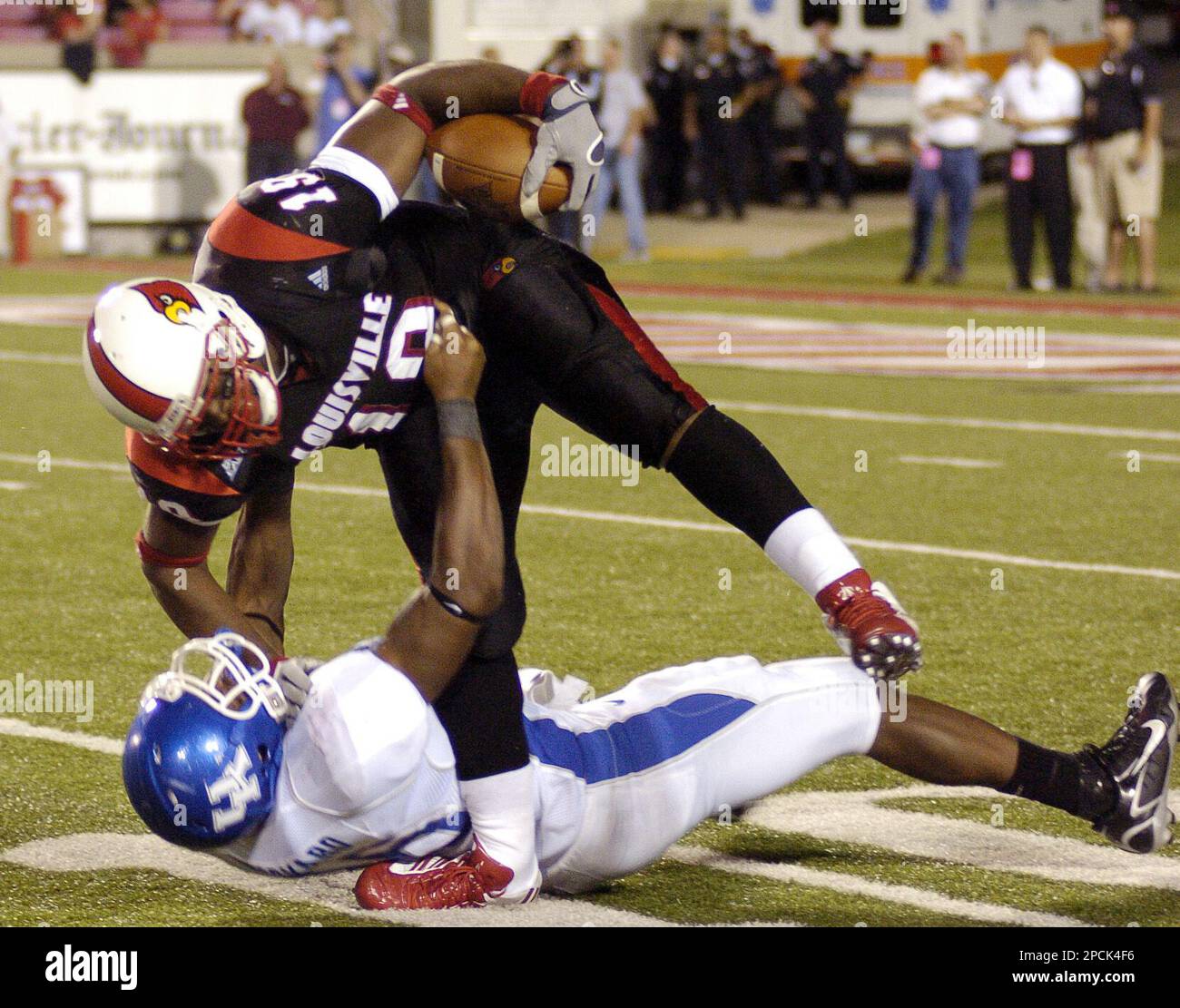 Louisville running back Michael Bush has his leg broken as Kentucky ...