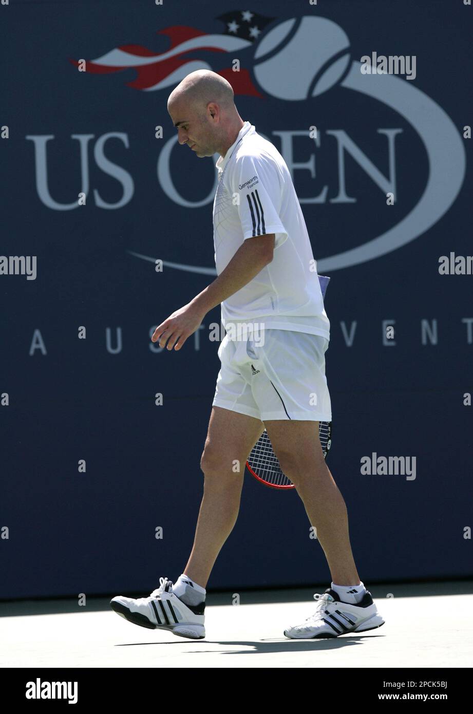 Andre Agassi walks on the court during his match against Benjamin ...