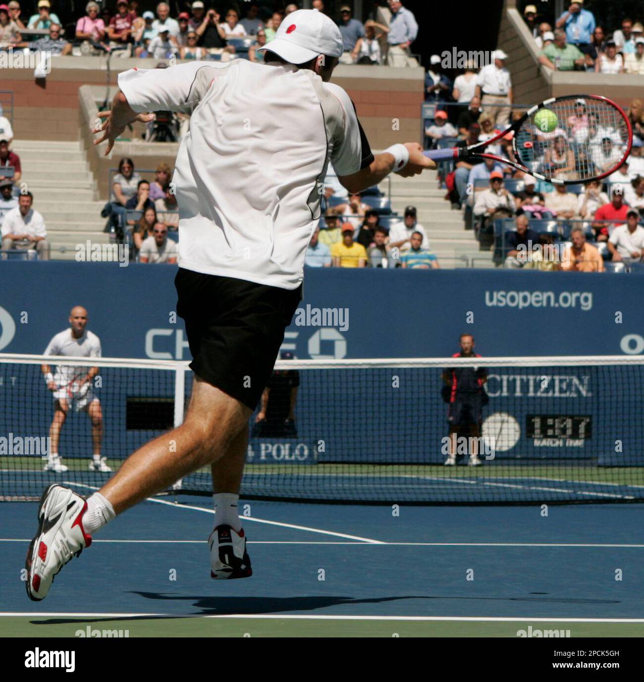 Benjamin Becker, of Germany, makes a return against Andre Agassi at the ...