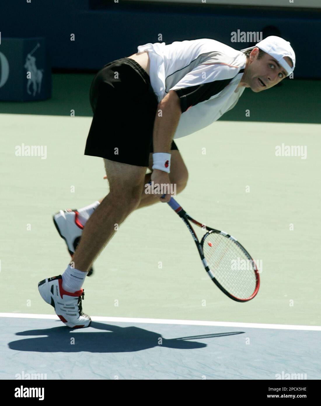 Benjamin Becker, of Germany, watches his return against Andre Agassi at ...