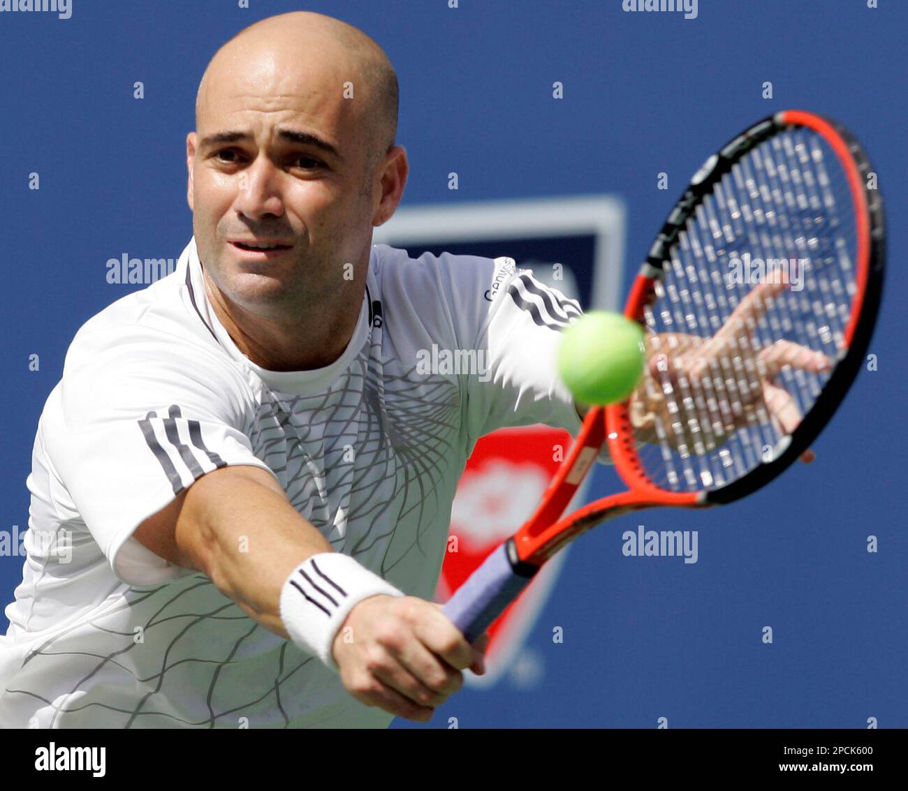 Andre Agassi makes a return against Benjamin Becker, of Germany, at the ...