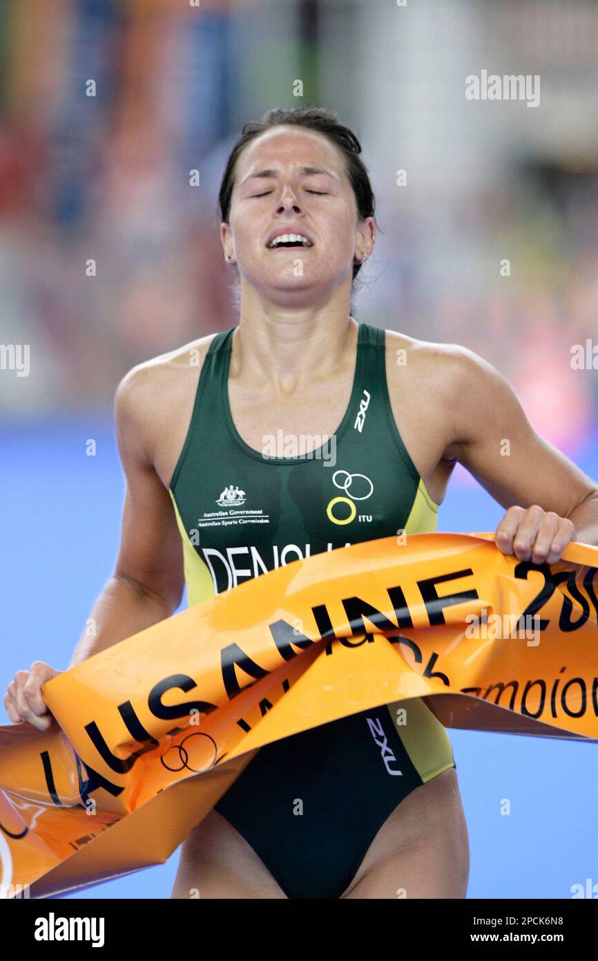 Australian Erin Densham celebrates as she crosses the finish line to ...