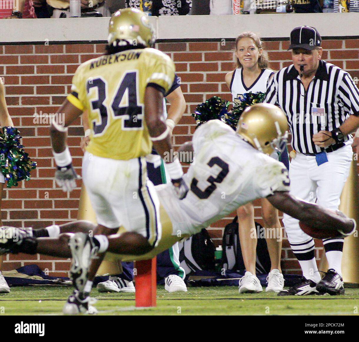 Notre Dame running back Darius Walker (3) scores in front of Georgia ...