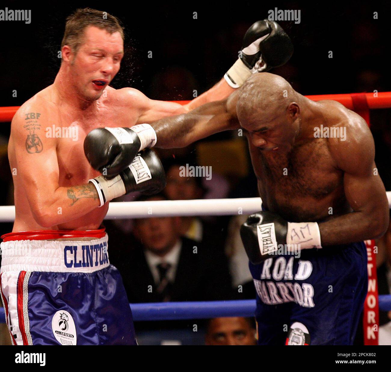 American boxer Glencoffe Johnson, right, lands a punch on British ...