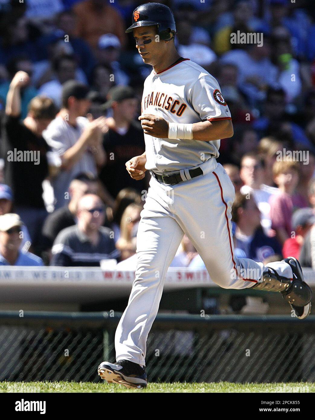 San Francisco Giants' Moises Alou rounds the bases after hitting a solo ...