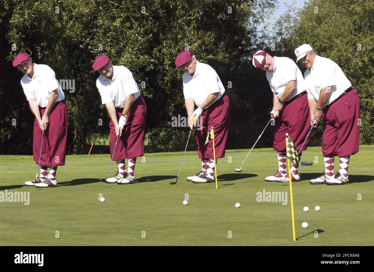 Warming up before their tee-time golfers Bob Brown, left, Dan Durkin ...