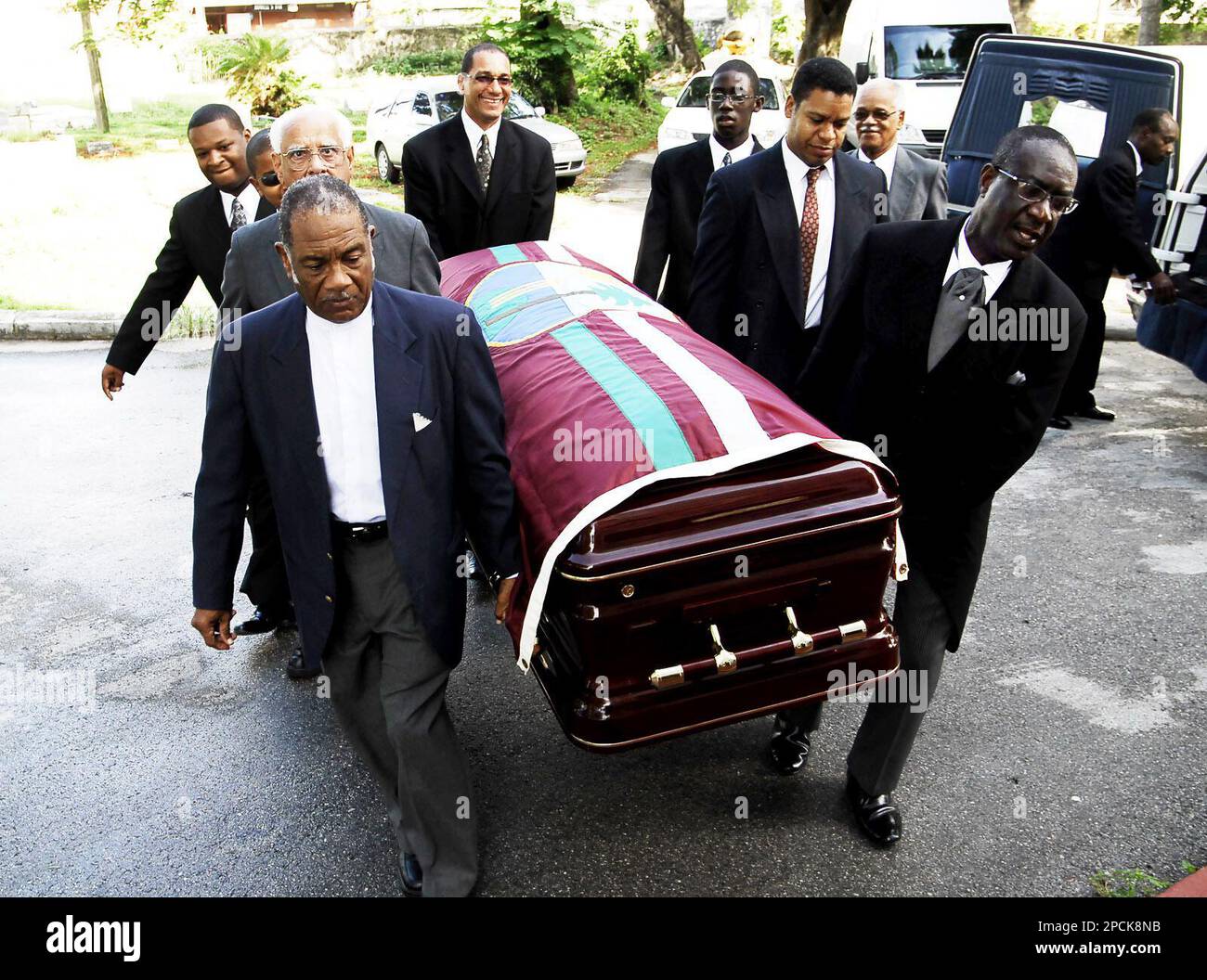 Family and friends are pictured carrying the casket of former West ...