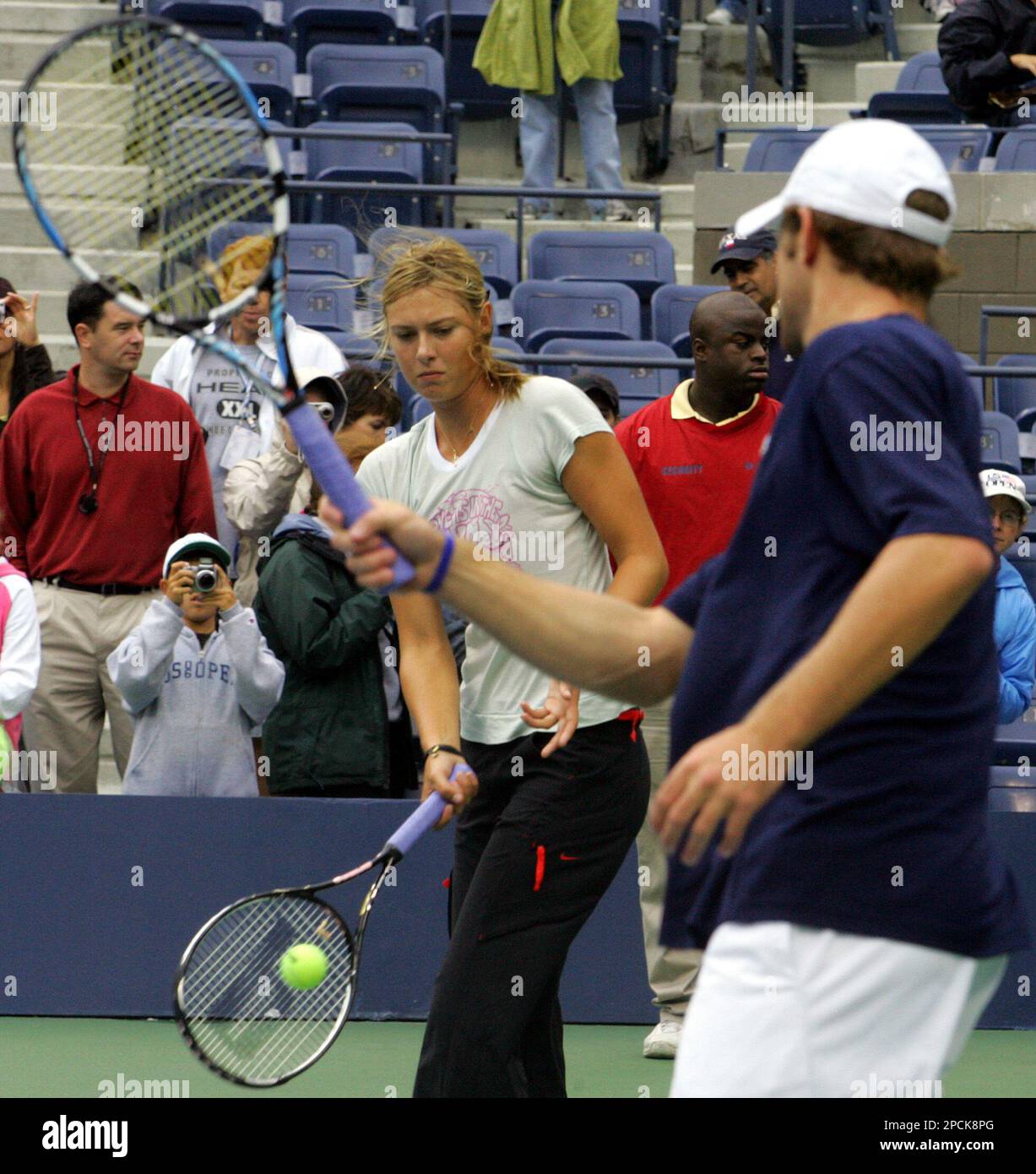 Maria Sharapova, of Russia, and Andy Roddick practice during a rain ...
