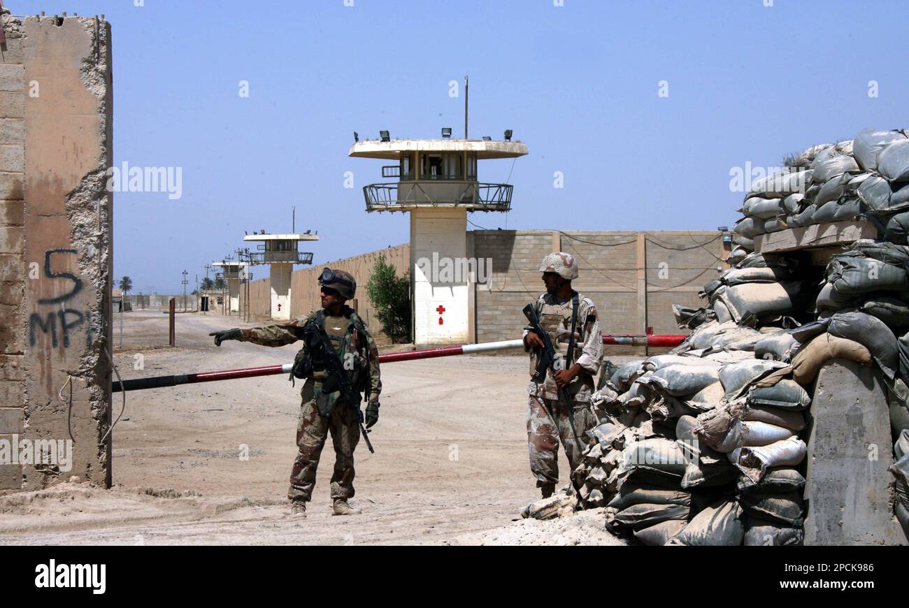 Iraqi army soldiers stand guard at the Abu Ghraib prison, after taking ...