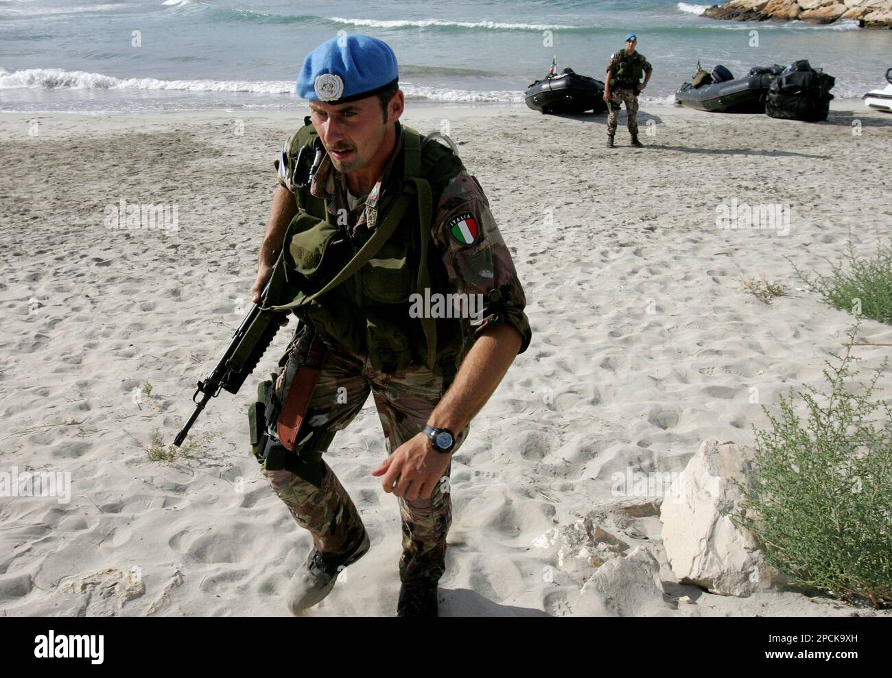 Italian U.N soldiers from UNIFIL guard the beach, Saturday, Sept. 2 ...