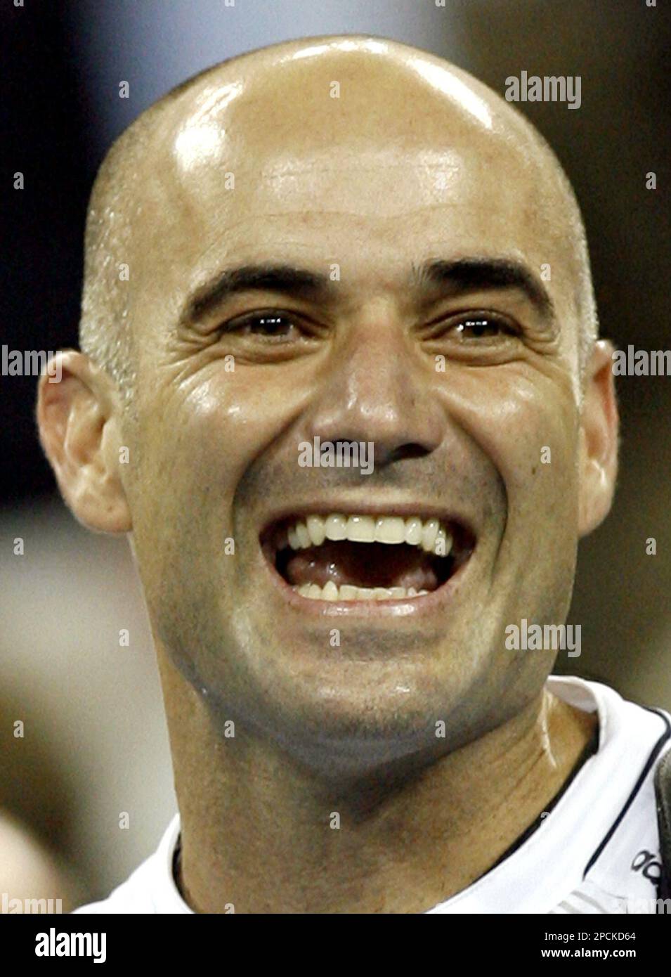 Andre Agassi of the United States smiles after he defeated Marcos ...