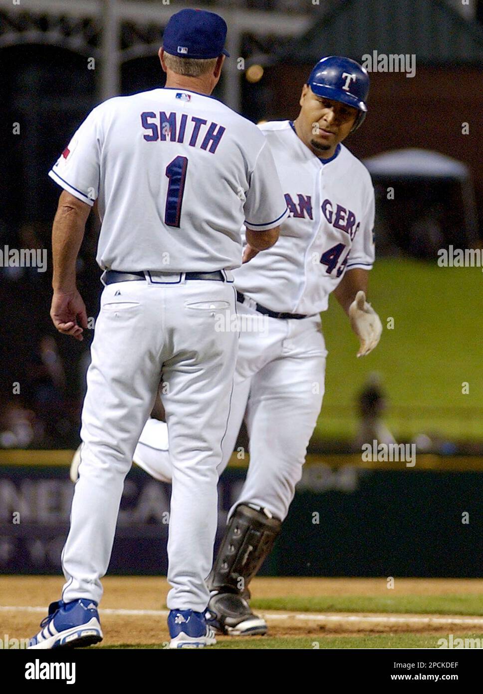 Texas Rangers left fielder Carlos Lee (45) is congratulated by third ...