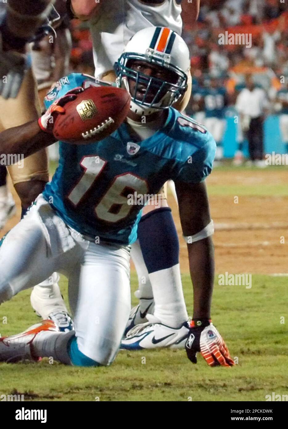 Miami Dolphins wide receiver Marcus Vick picks himself up after scoring ...