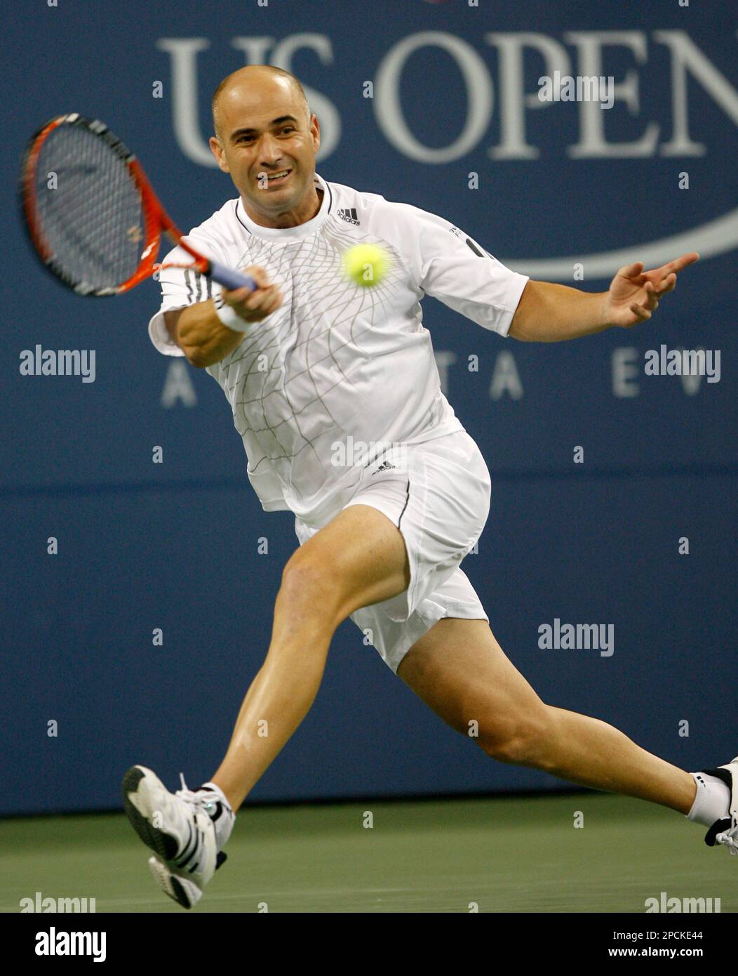 Andre Agassi of the United States follows through on a return Marcos ...