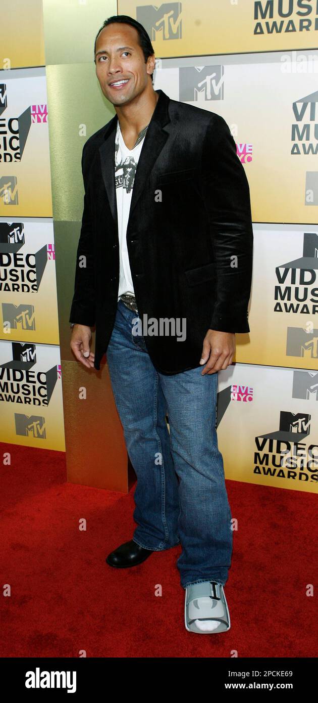 Dwayne 'The Rock' Johnson arrives with his foot in a cast at the 2006 ...