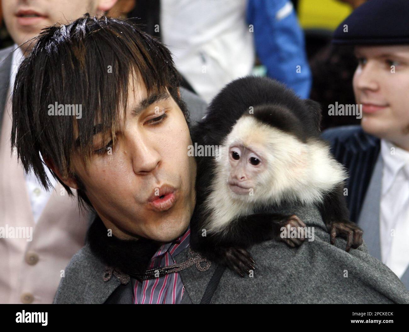 Peter Wentz, from the group Fall Out Boy, arrives with a monkey at the ...