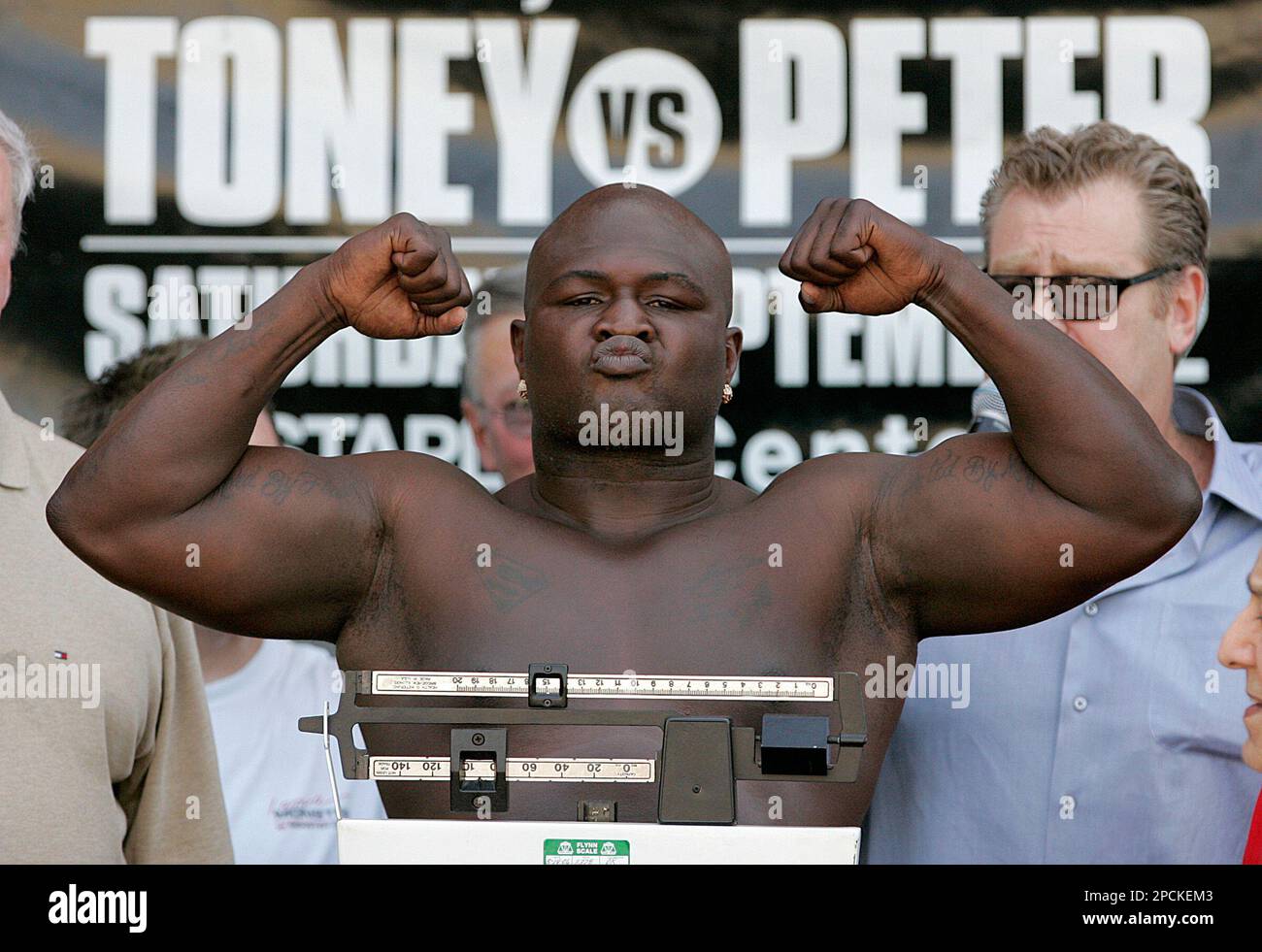 Boxer James Toney flexes on the scale during the official weigh-in ...