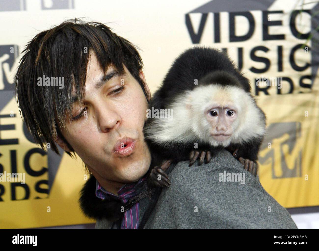 Peter Wentz, from the group Fall Out Boy, arrives with a monkey at the ...