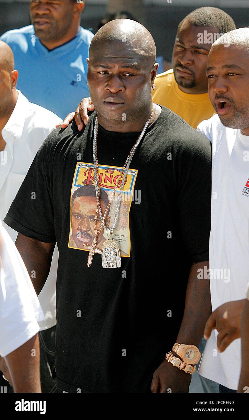 James Toney, center, and his advisor Sam Watson, right, leave the ...