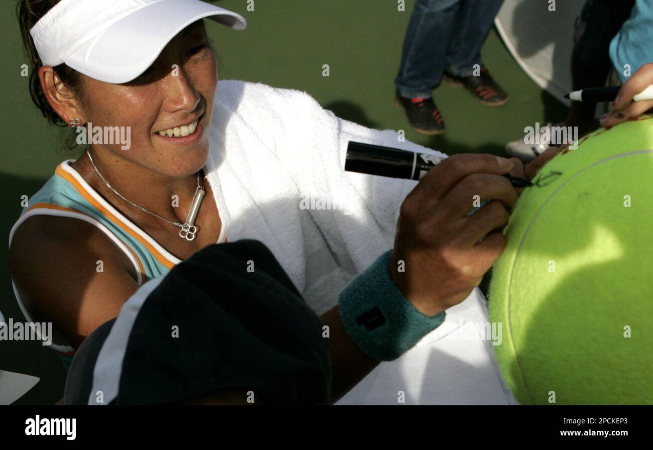 Ai Sugiyama of Japan signs autographs after defeating Tathiana Garbin ...