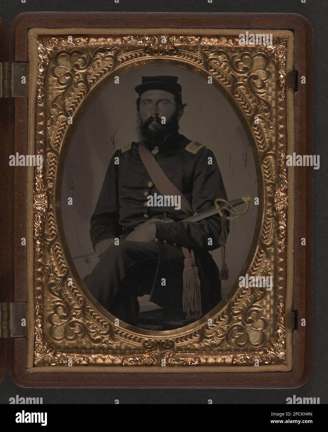 Unidentified soldier in Union Captain uniform with crimson sash holding ...