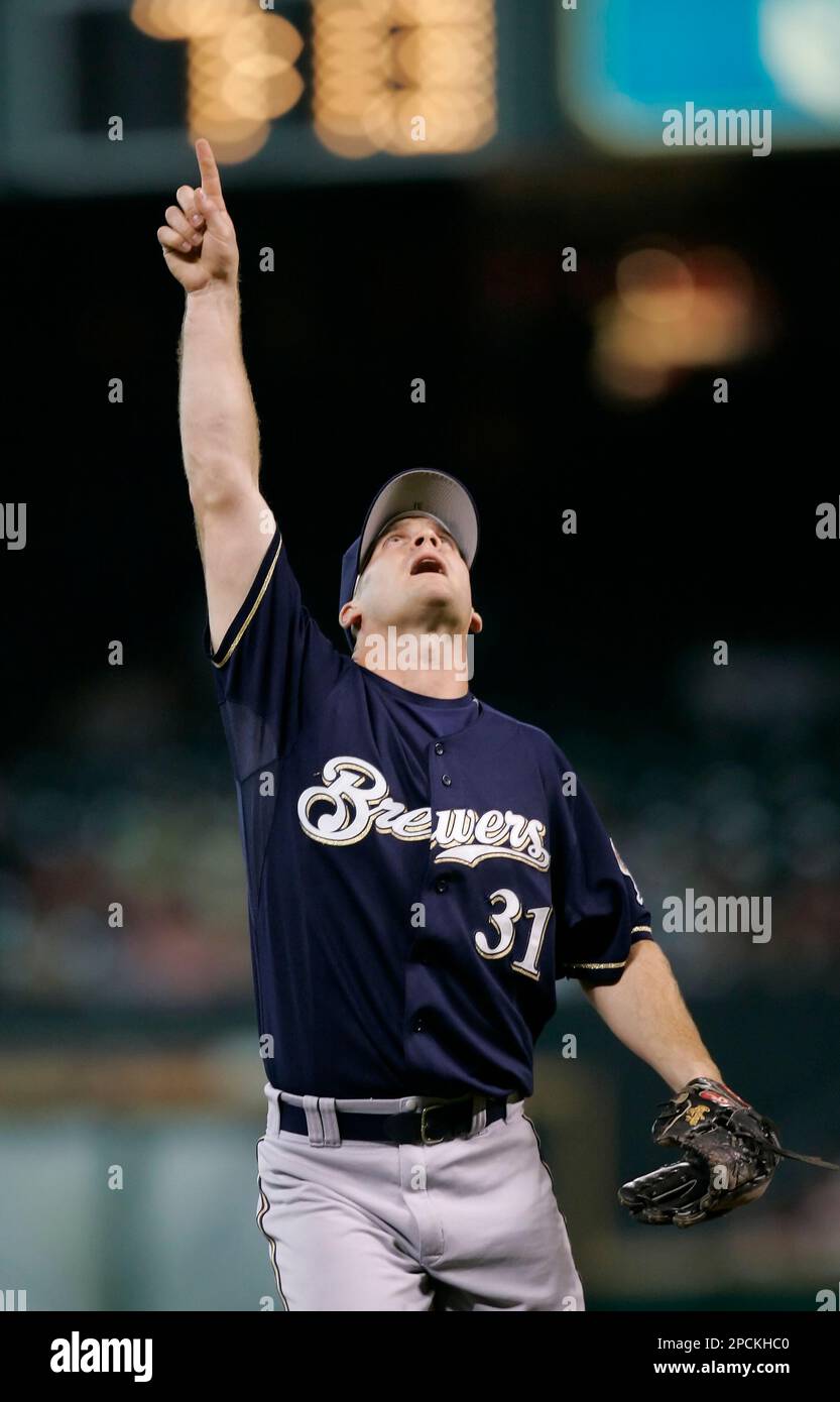 Milwaukee Brewers pitcher Dave Bush (31) points to an infield pop fly ...