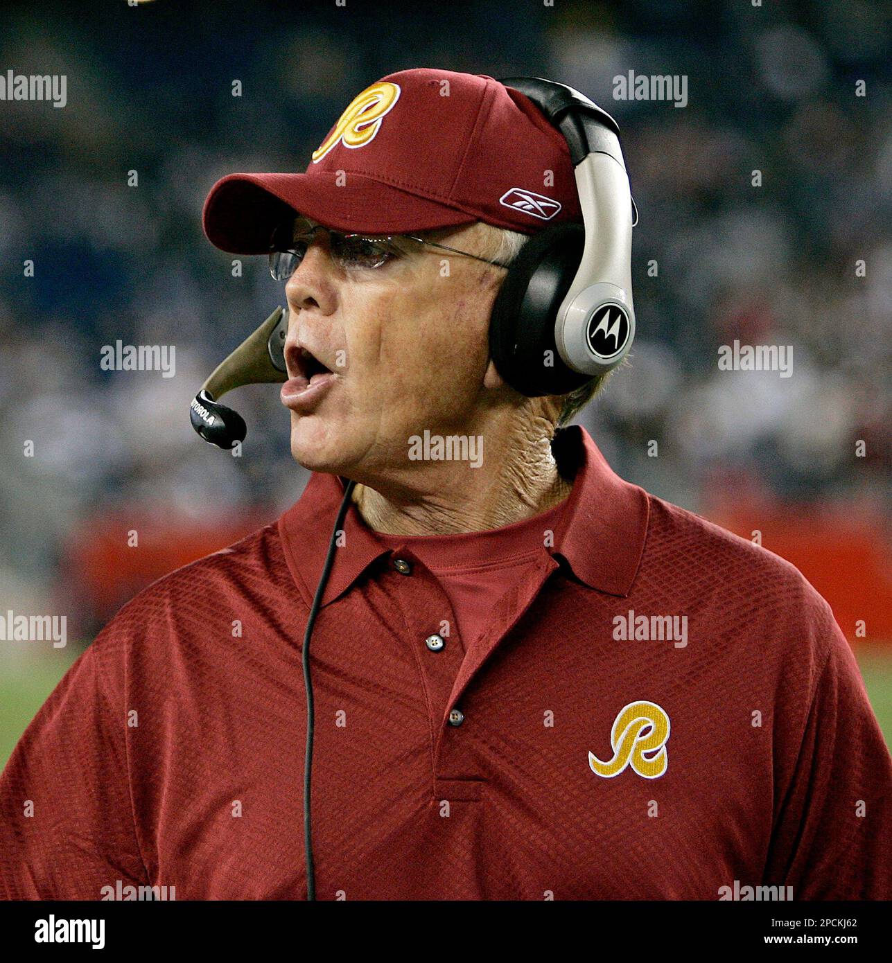 ** FILE ** Washington Redskins coach Joe Gibbs talks with his players ...