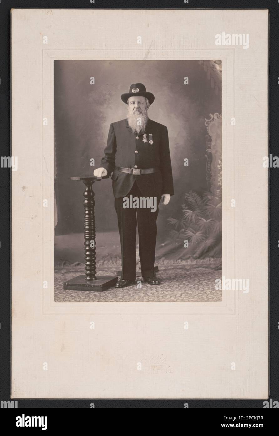 Unidentified Civil War veteran with medals in front of painted backdrop ...