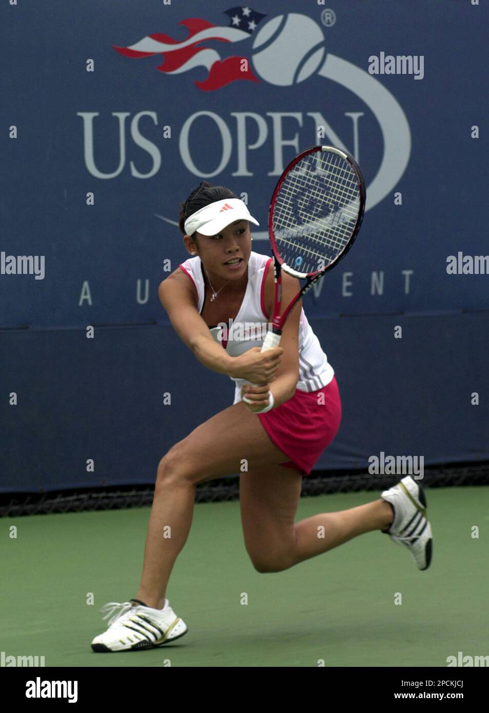 Aiko Nakamura of Japan follows through on a return to Melinda Czink of ...