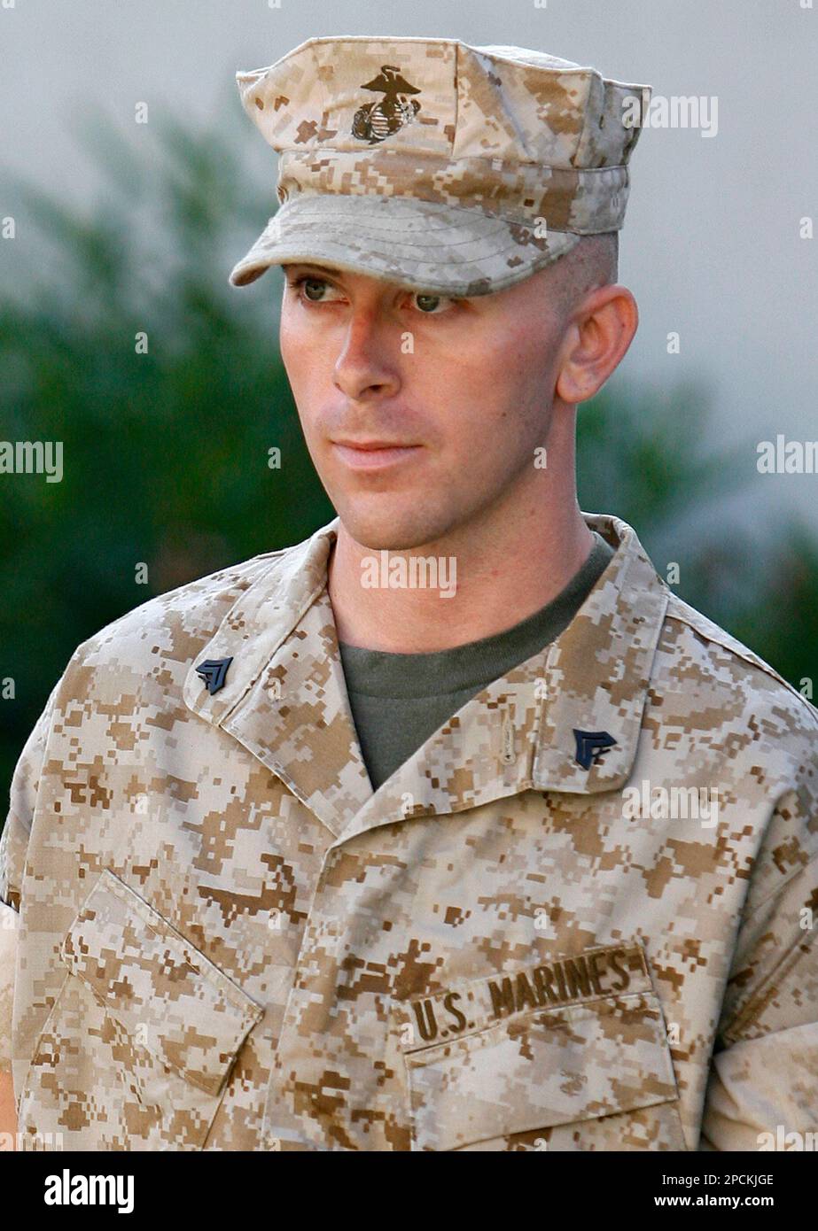 Marine Corps Cpl. Marshall Magincalda enters a pretrial hearing being ...