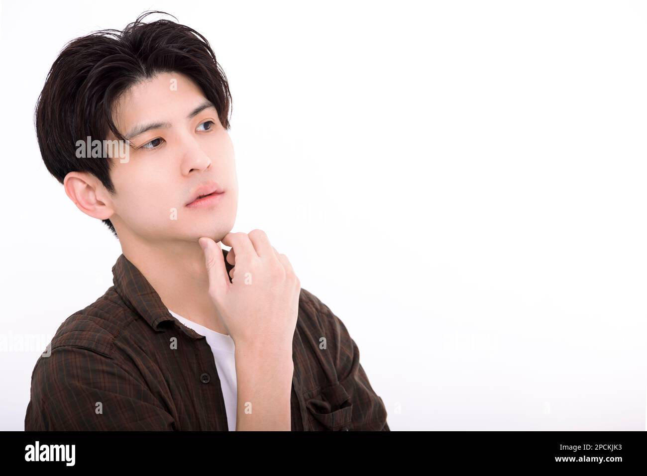 Young man thinking and worry for problem Stock Photo - Alamy