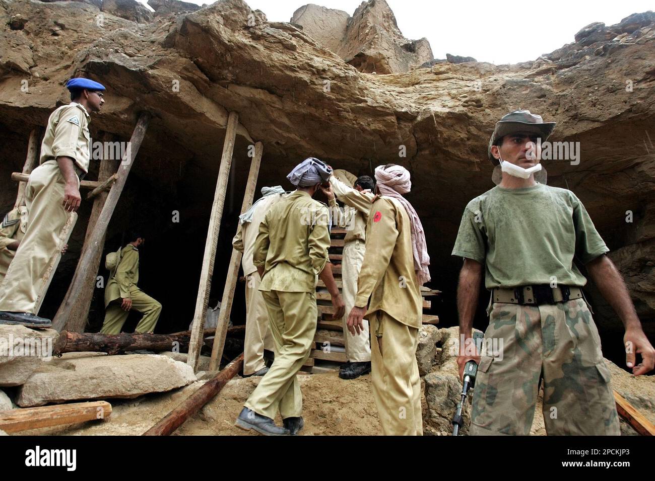 Soldiers of Pakistan army work in a cave Wednesday, Aug. 30, 2006 to ...