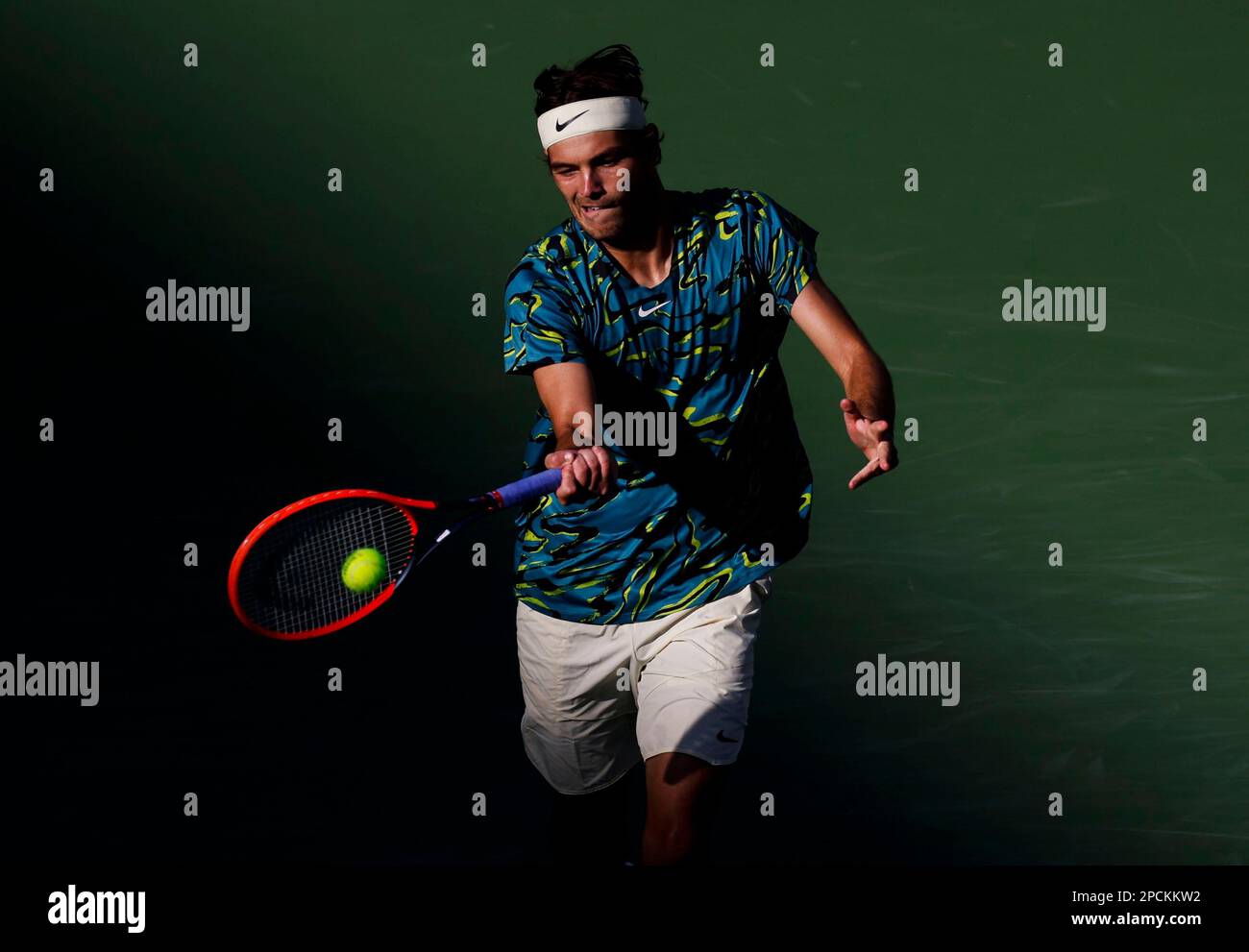 Indian Wells, California, USA. March 13, 2023 Taylor Fritz returns a ...