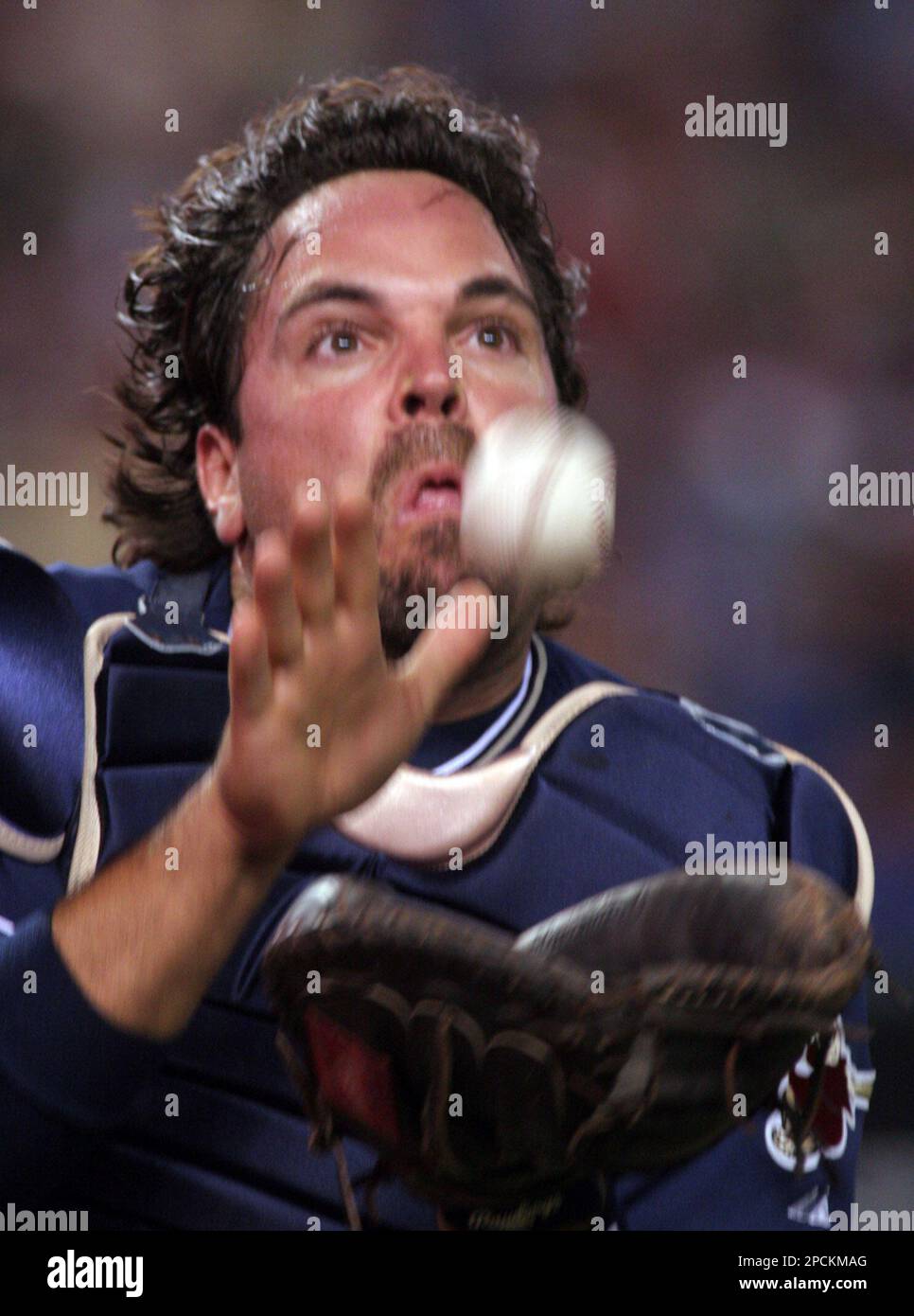 San Diego Padres catcher Mike Piazza makes a sliding catch on a bunt ...