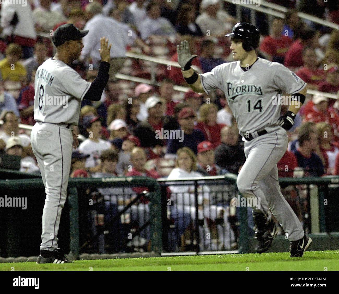 Florida Marlins' Josh Willingham (14) is congratulated by third base ...