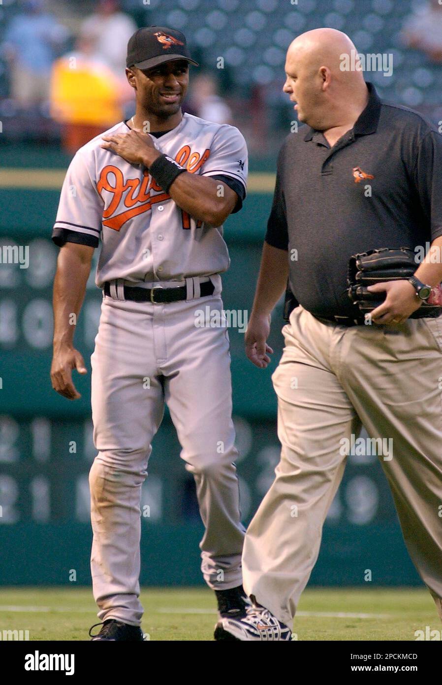 Baltimore Orioles center fielder Corey Patterson, left, reaches for his ...