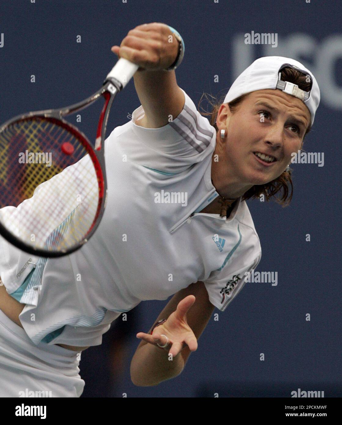 Kristina Barrois of Germany follows through on a serve to Amelie ...