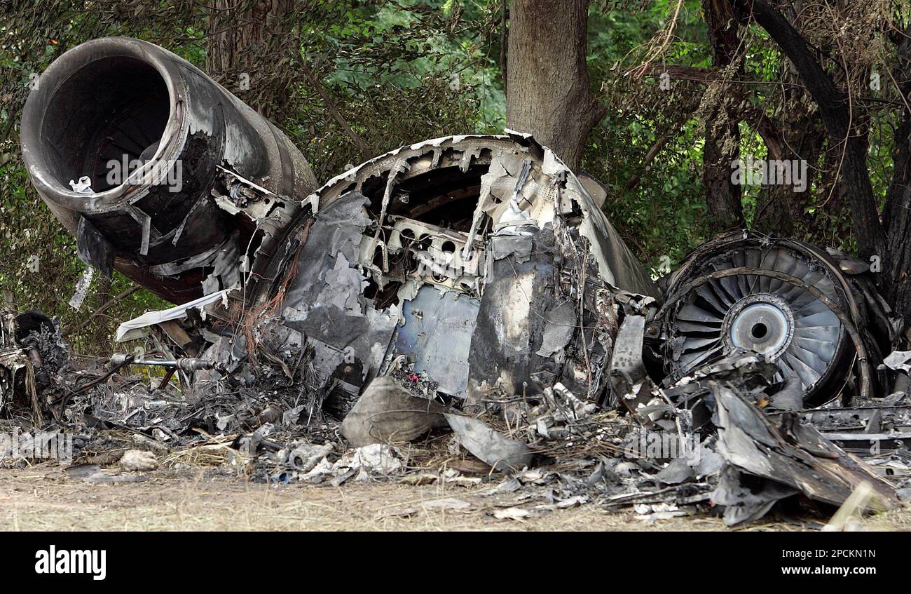 Wreckage from Comair Flight 5191 lies in a wooded area near Blue Grass ...