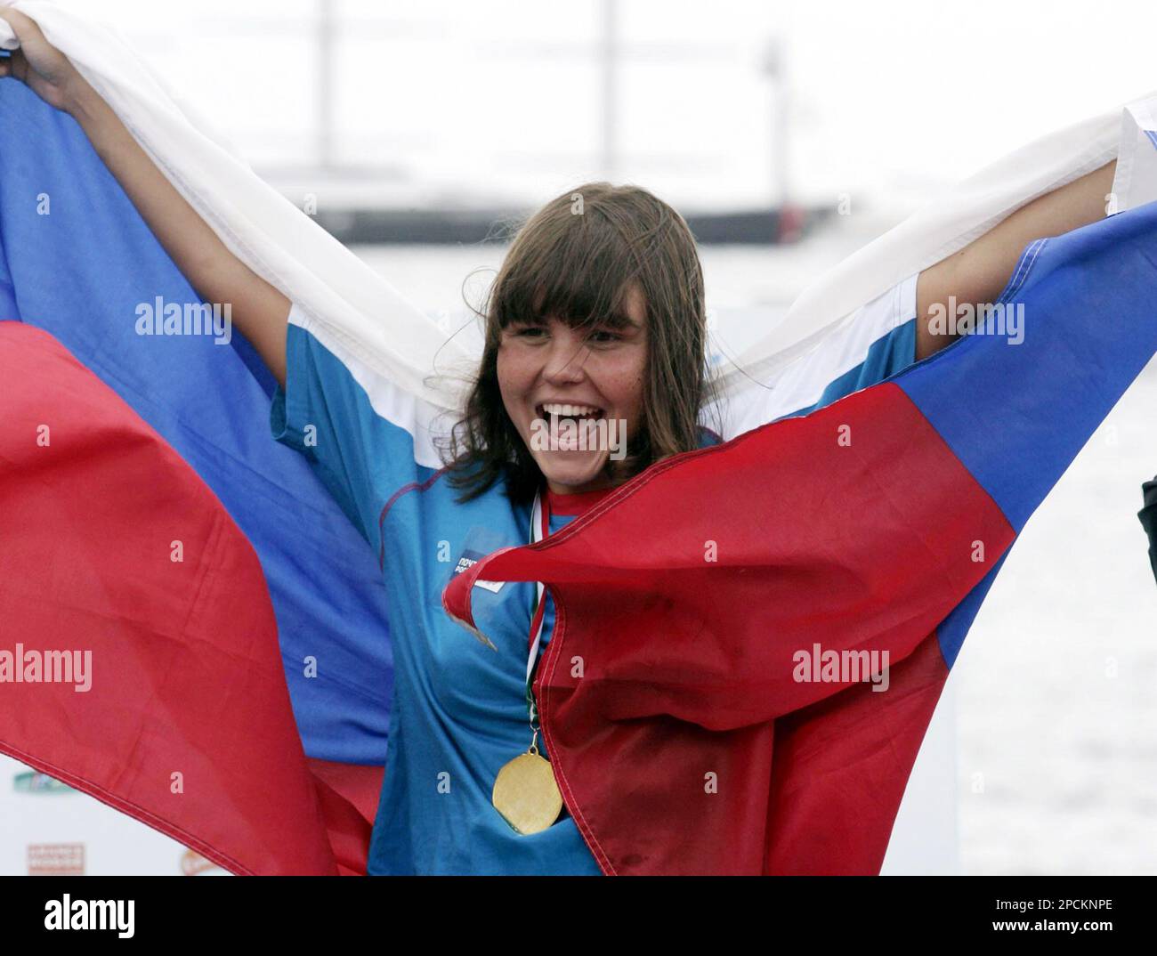 Russia's Larisa Ilchenko celebrates on the podium after winning the 5 ...