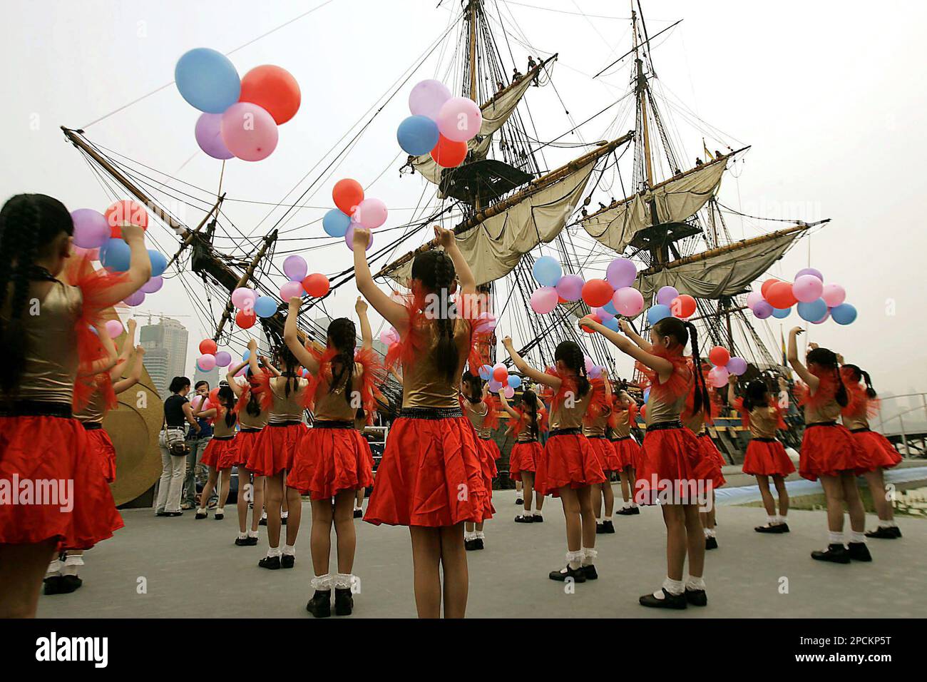 Young Chinese performers welcome the Swedish ship Gotheborg, a ...