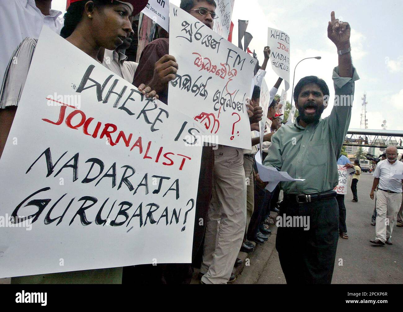 Sri Lankan journalists shout slogans during a protest over kidnapping ...