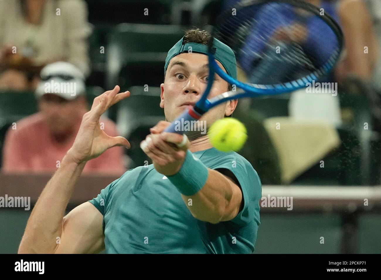 Jack Draper, of Britain, returns a shot to Andy Murray, of Britain, at ...