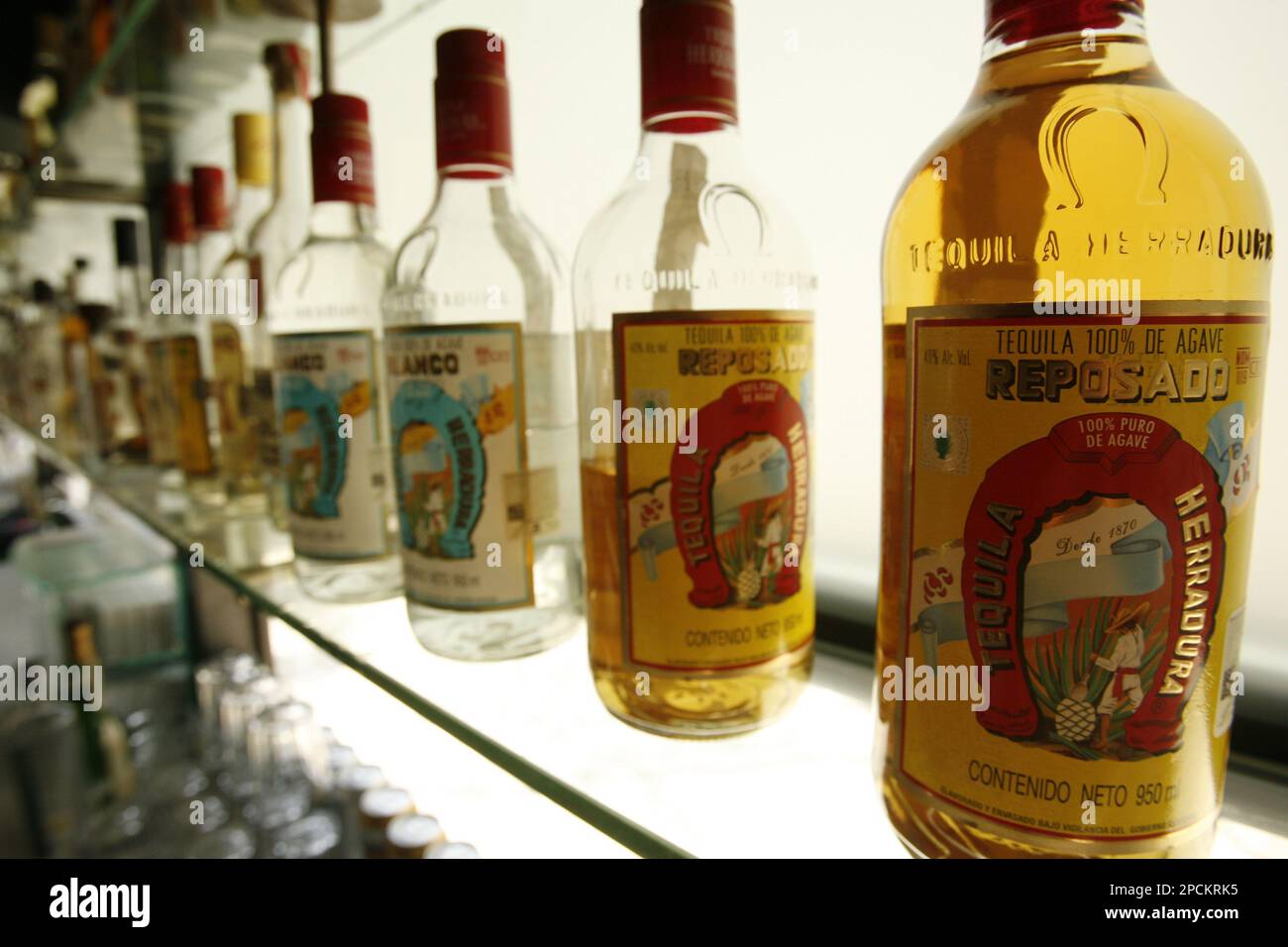 Bottles of white and aged Tequila Herradura are seen on display at a ...