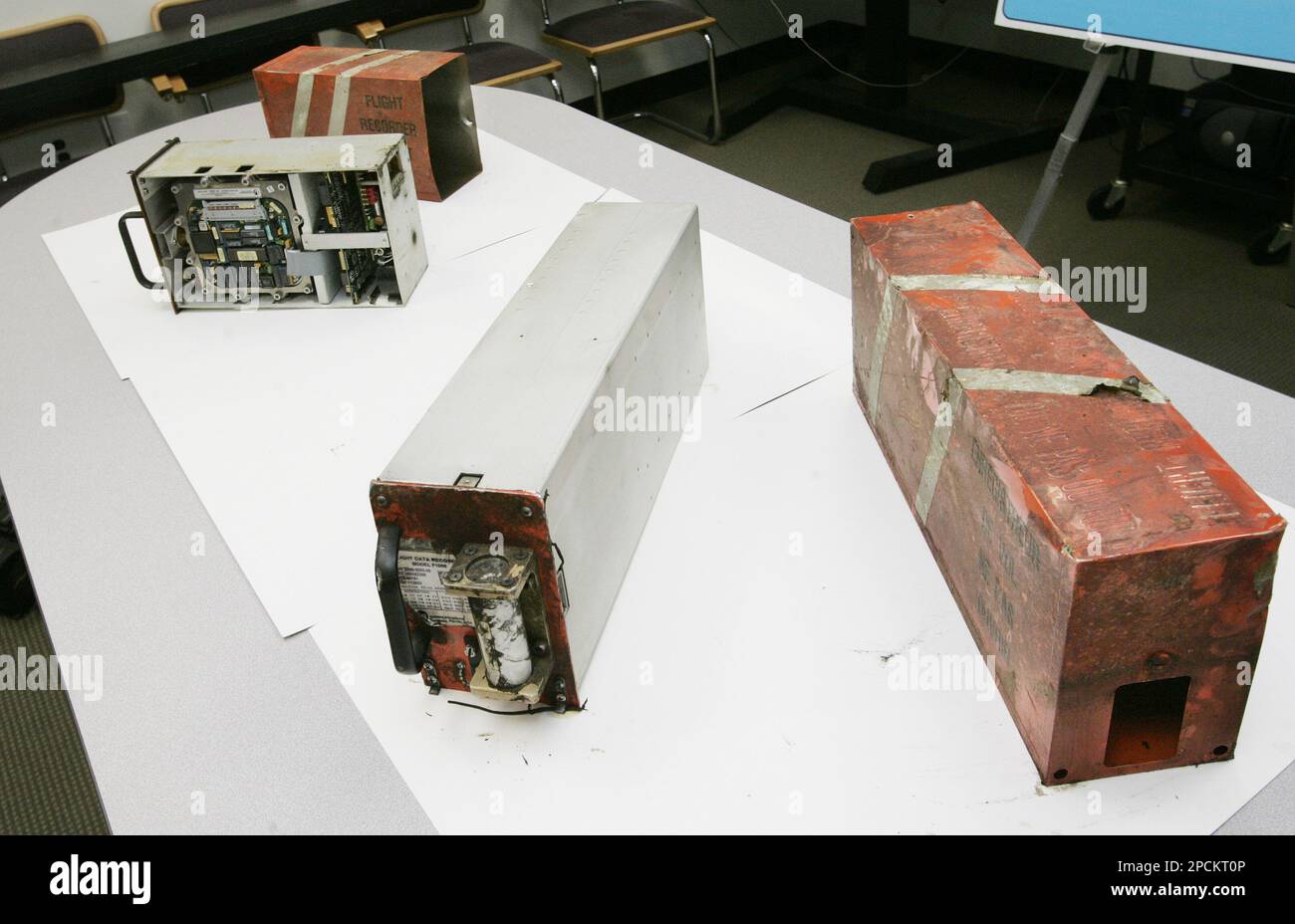 The cockpit voice recorder, left and the flight data recorder, right ...