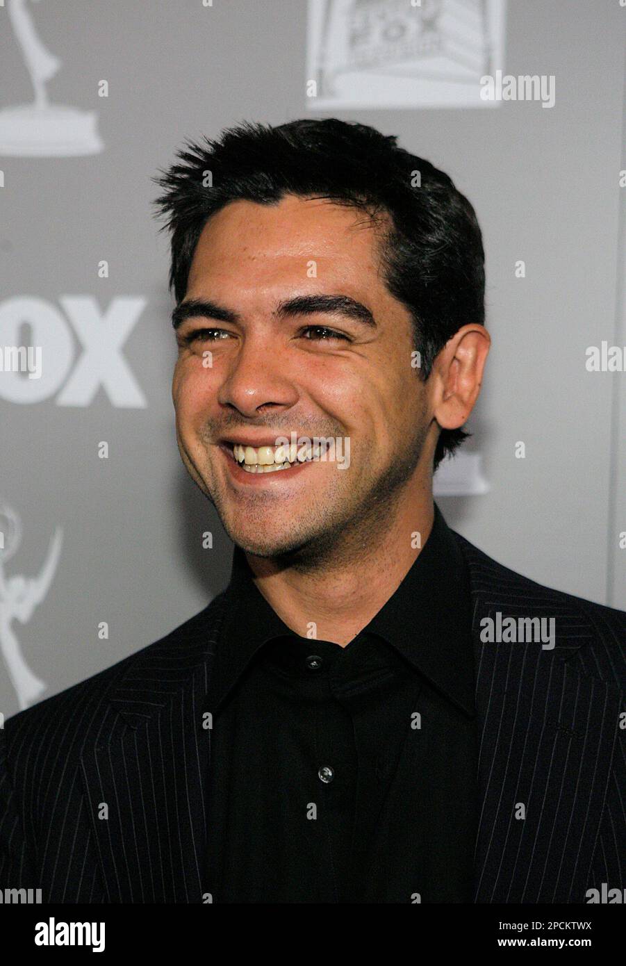 Actor Alexis Cruz poses for photographers as he arrives at the post ...