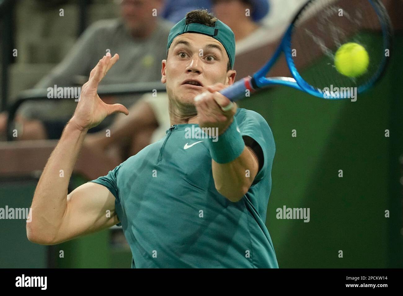 Jack Draper, of Britain, returns a shot to Andy Murray, of Britain, at ...