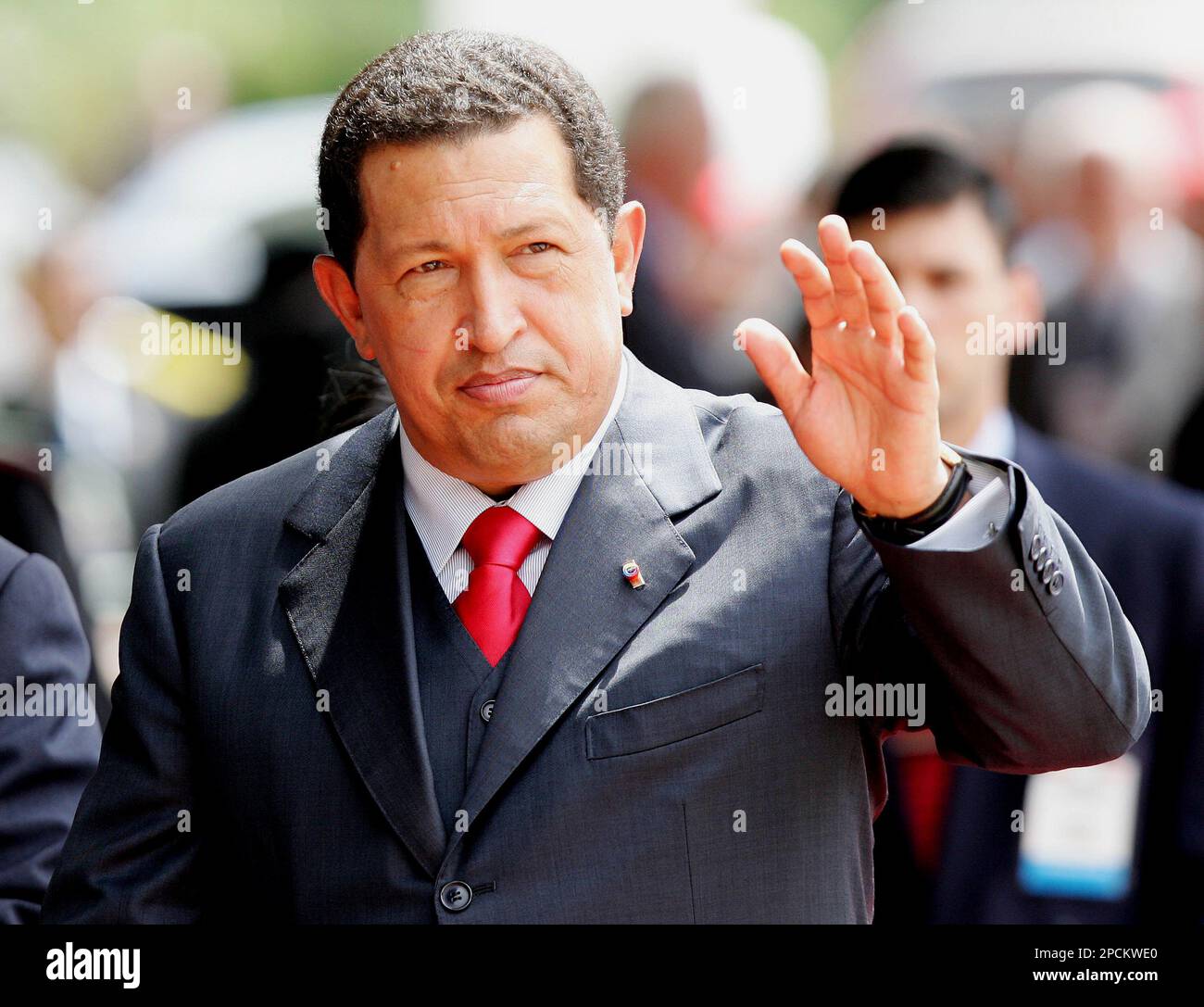 Venezuela President Hugo Chavez, waves to the media after inspecting ...