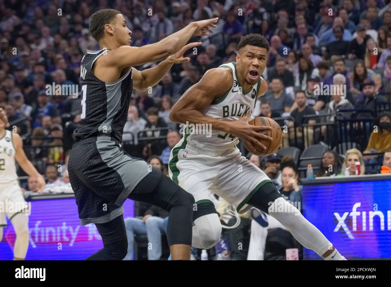 Milwaukee Bucks forward Giannis Antetokounmpo, right, is guarded by Sacramento Kings forward ...