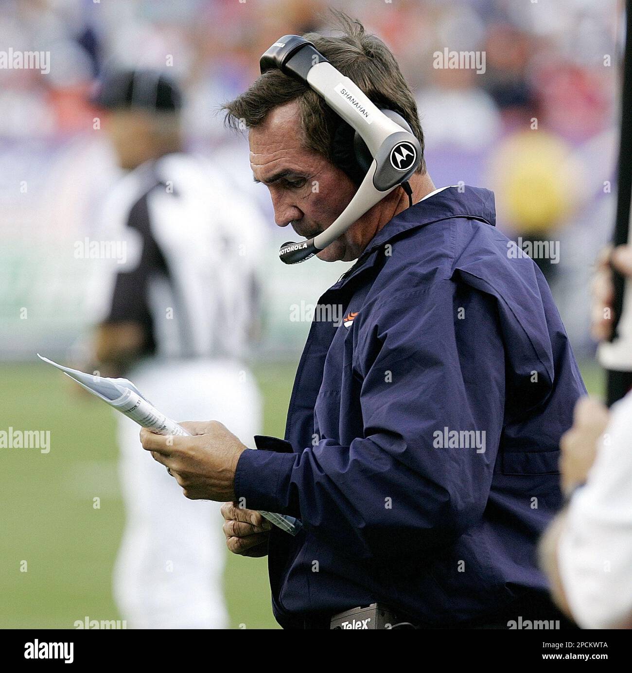Denver Broncos head coach Mike Shanahan checks his play chart during ...