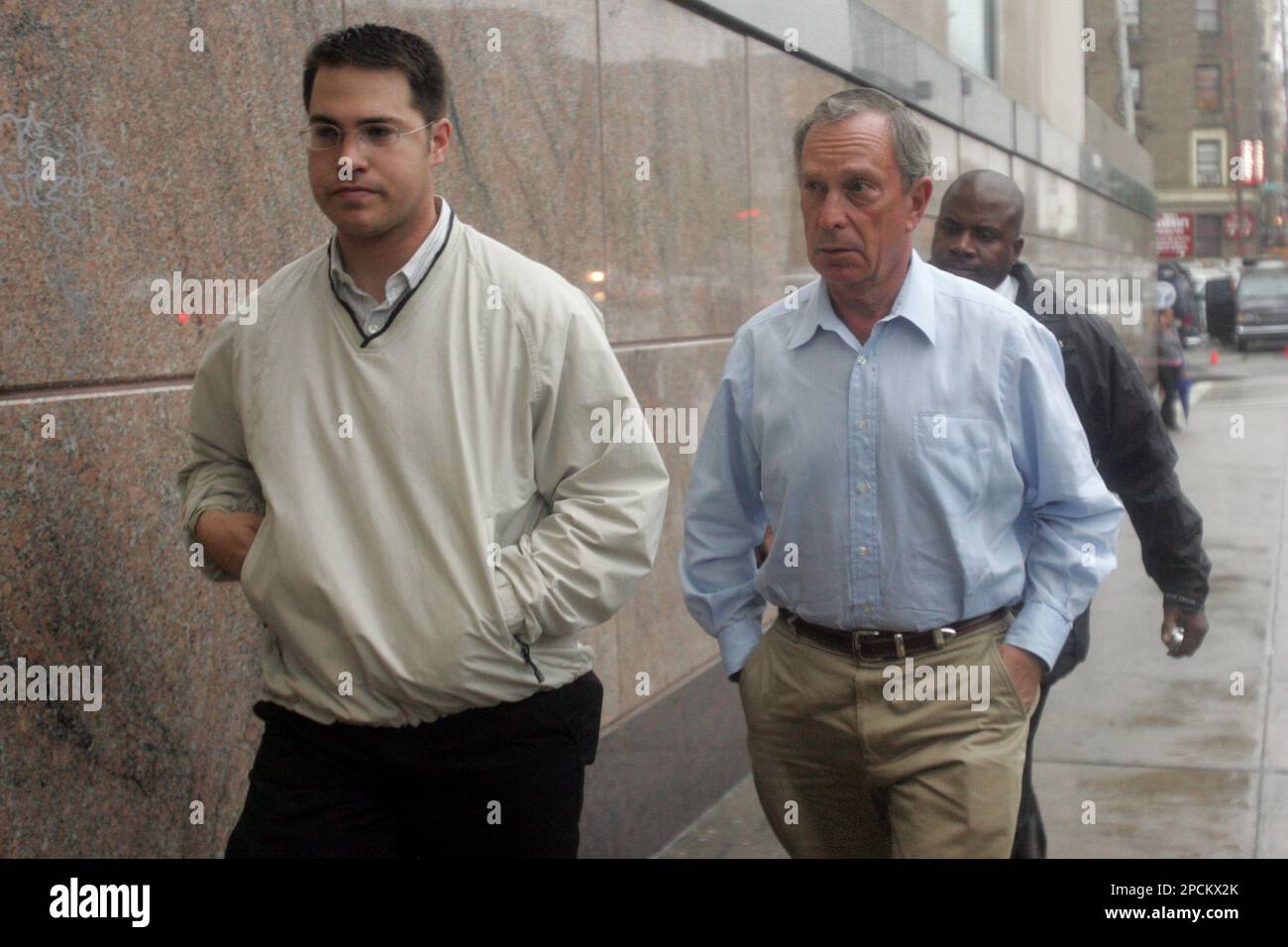 New York City Mayor Michael Bloomberg, right, arrives with an ...